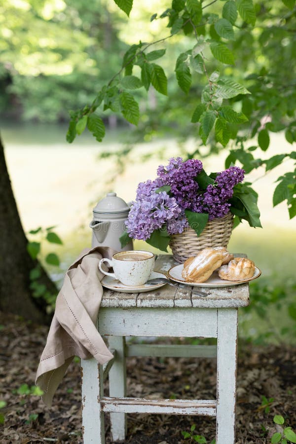 Breakfast in the Garden: Eclairs, Cup of Coffee, Coffee Pot, Lilac ...