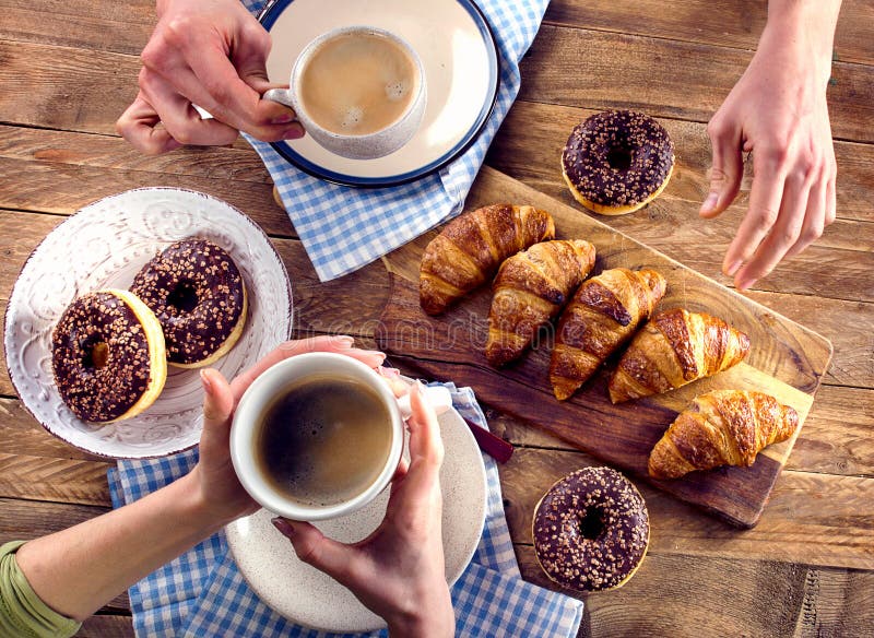Breakfast. Hands Holding Cups of Coffee and Croissants Stock Photo ...