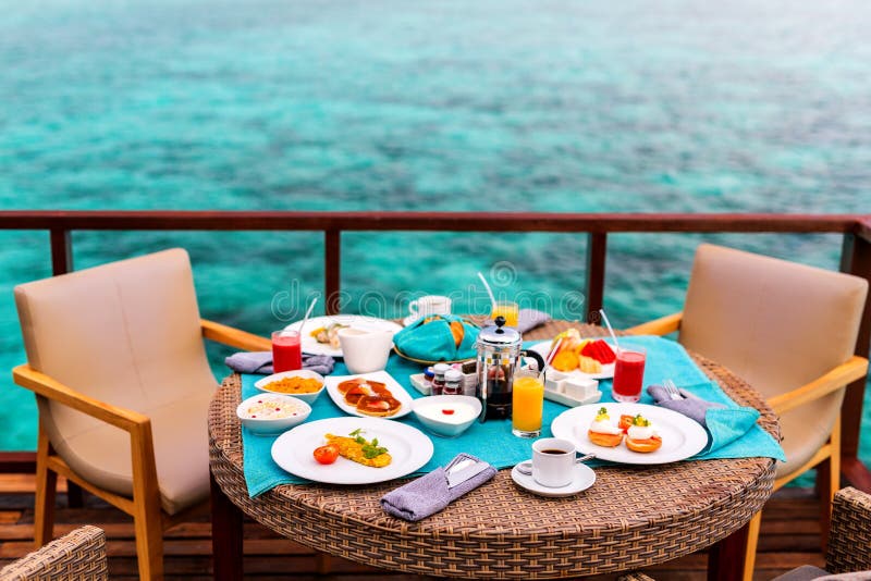 Breakfast at ocean edge stock image. Image of water - 157427625