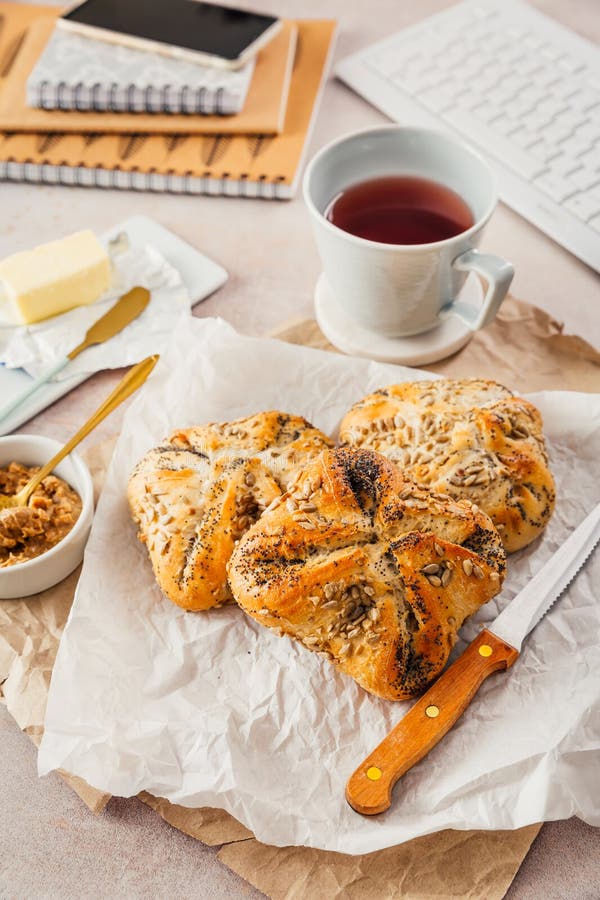 Breakfast at Office Workplace, Fresh Bread Rolls with Butter and Cup of ...