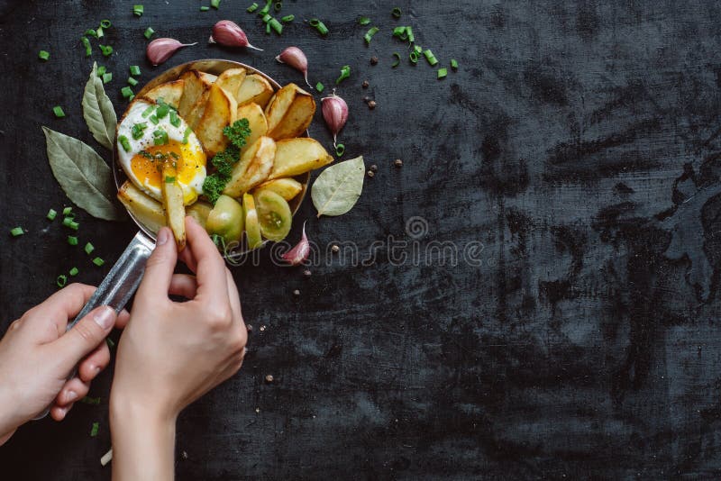 Breakfast in Pan with Fried Eggs, Potatoes, Fresh Herbs on Dark ...