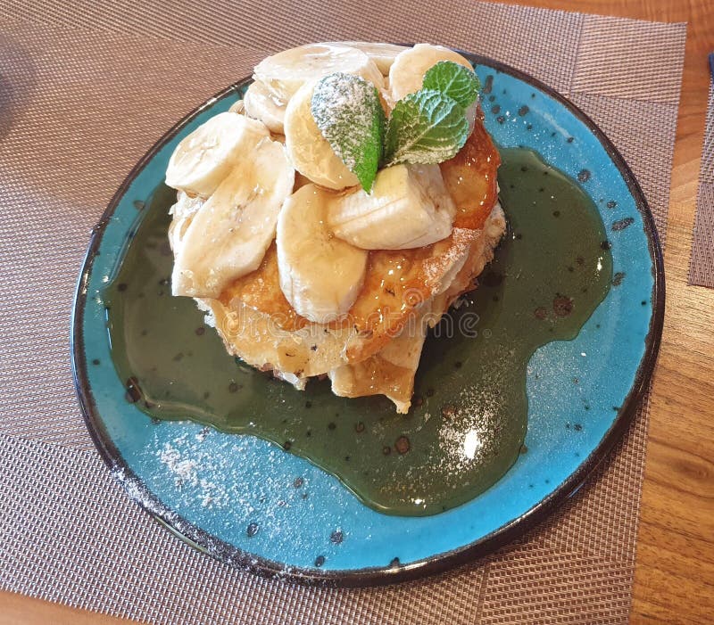 Breakfast Pancakes with Banana and Smooth Maple Syrup Stock Photo ...