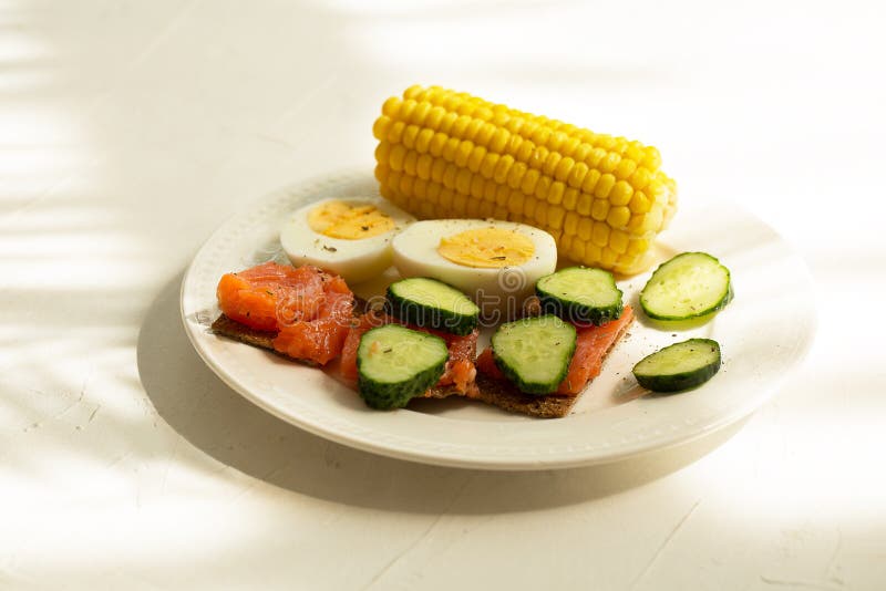Breakfast Plate on White Texture Background. Fish, Eggs, Cucumbers and ...
