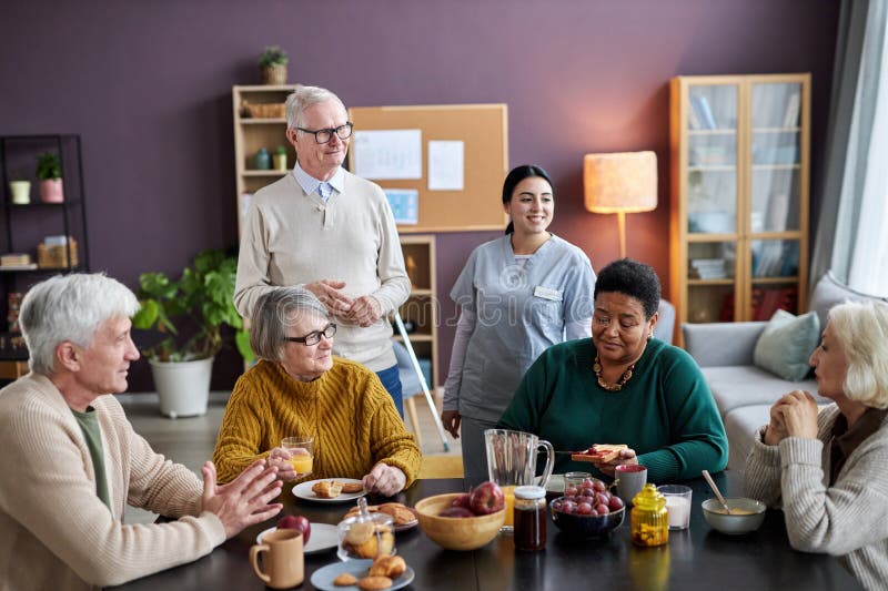 Breakfast Scene in Retirement Home with Smiling Senior People Stock ...