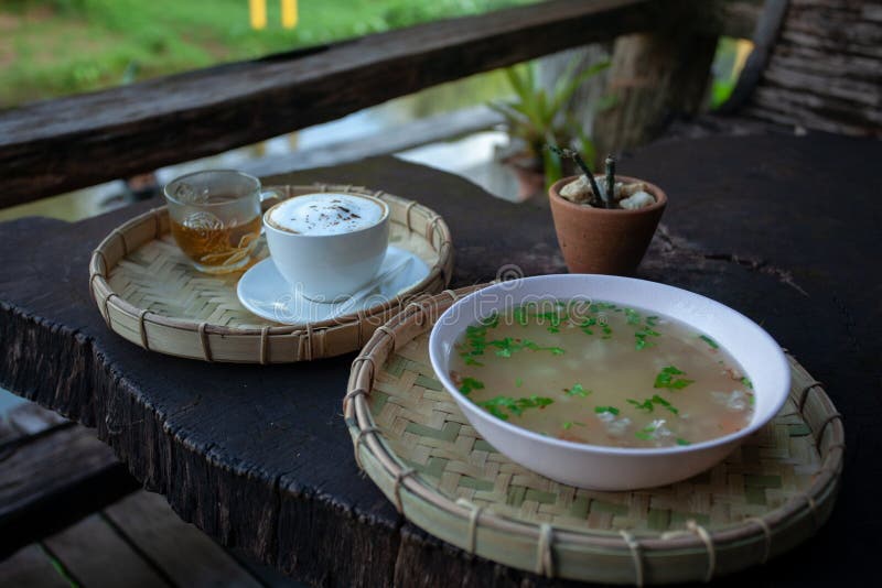 Breakfast Served with Boiled Rice and Coffee on Old Wooden Table Stock ...