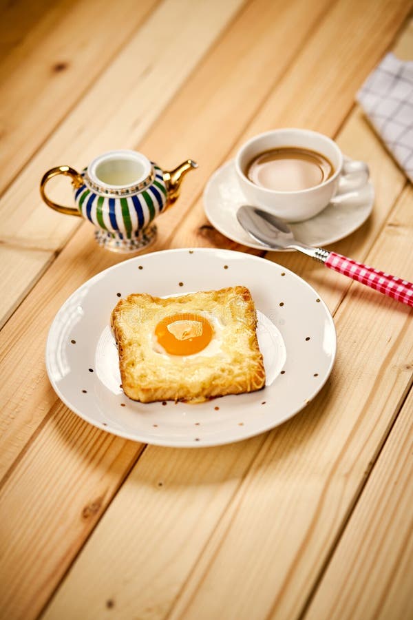 Breakfast Set with Coffee and Toast with Egg on Wooden Table Stock ...