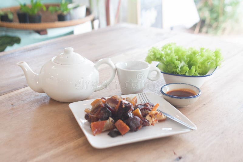 The Breakfast Set Features White Teapot and Teacups with Roasted Pork ...