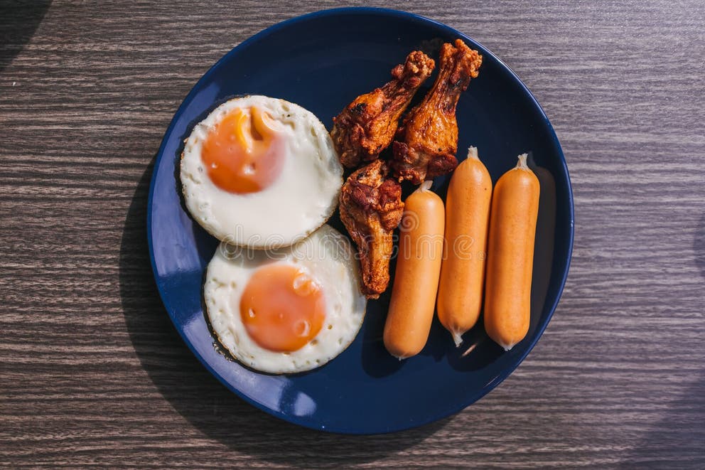 Breakfast Set of Fried Eggs, Sausage and Fried Chicken Wing Stock Photo ...