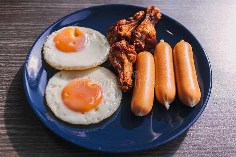 Breakfast Set of Fried Eggs, Sausage and Fried Chicken Wing Stock Photo ...