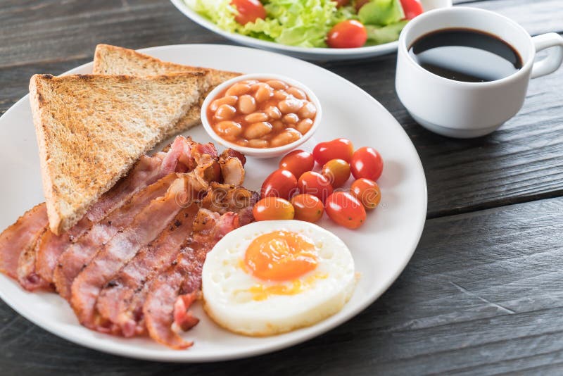 Breakfast set on wood stock image. Image of sausage, plate - 85607489