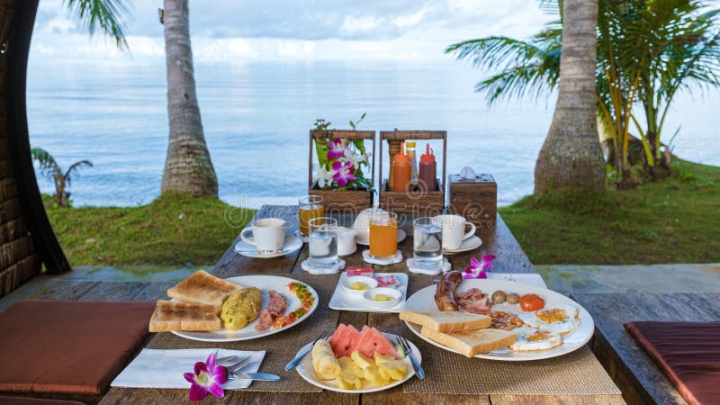Breakfast Table on the Beach with Palm Trees in Thailand Stock Photo ...