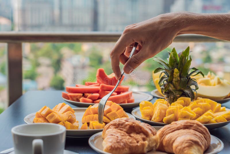 Breakfast Table with Coffee Fruit and Bread Croisant on a Balcony ...