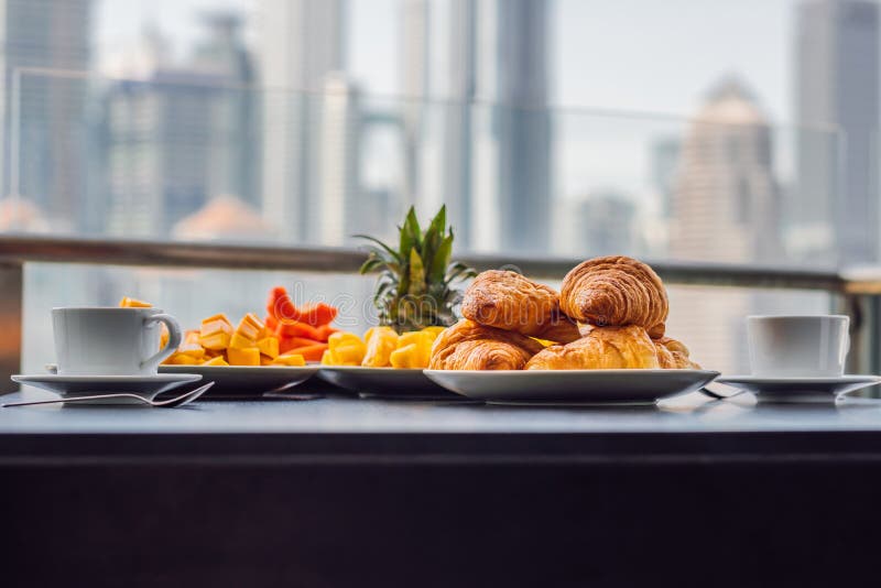 Breakfast Table with Coffee Fruit and Bread Croisant on a Balcony ...