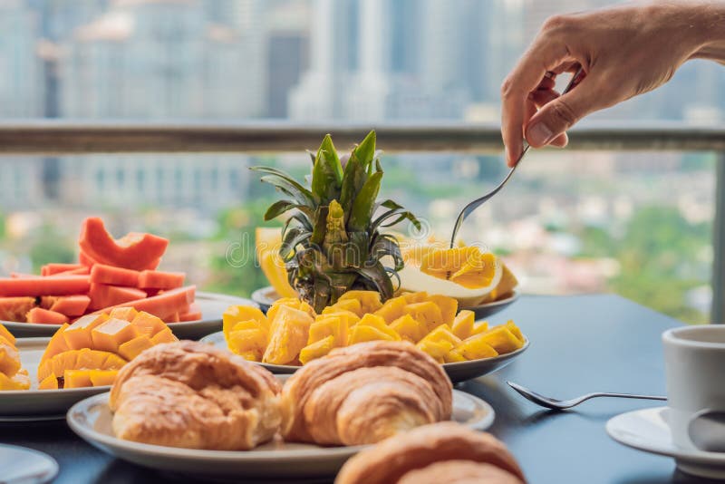 Breakfast Table with Coffee Fruit and Bread Croisant on a Balcony ...