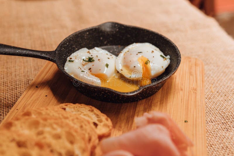 Breakfast Table Setting with Eggs, Bread and Ham on a Wooden Table ...