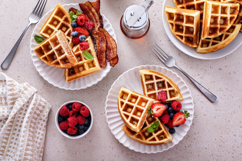 Breakfast Table with Waffles, Bacon, Breakfast Sausage, Croissants and ...