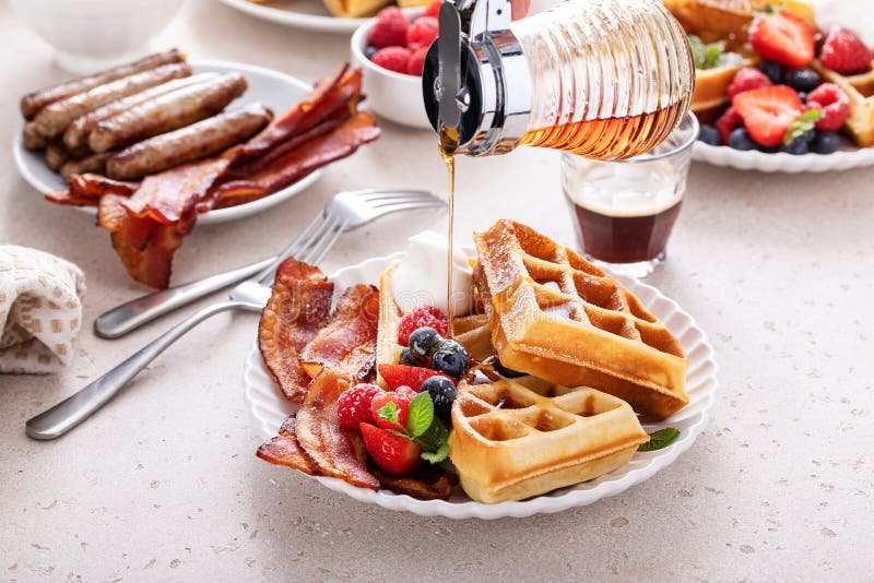 Breakfast Table with Waffles, Croissants and Bacon Stock Photo - Image ...