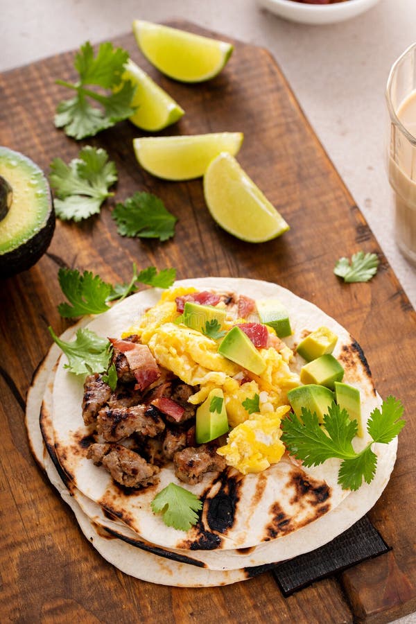 Breakfast Tacos with Sausage, Eggs, Bacon and Avocado Stock Photo ...