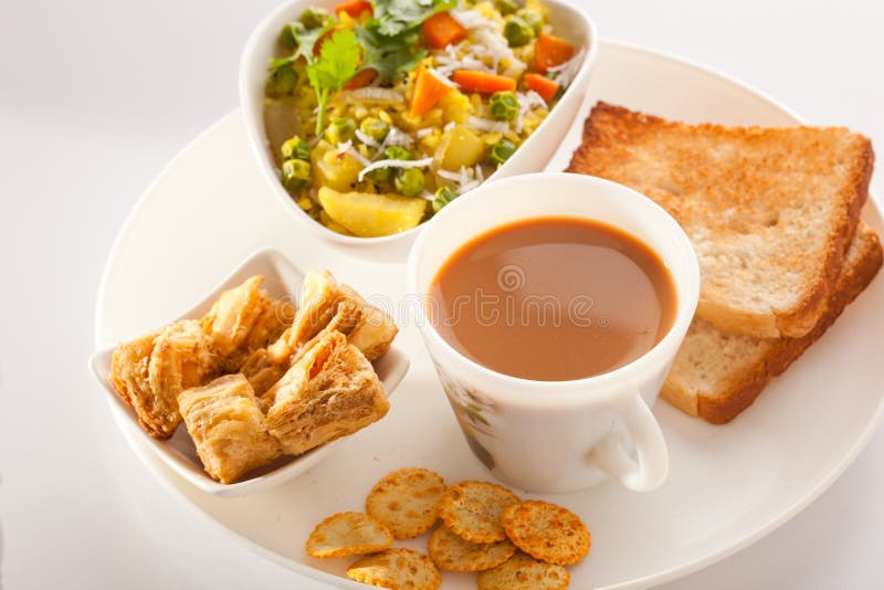 Breakfast - Tea, Poha with Bread and Biscuit. Stock Photo - Image of ...