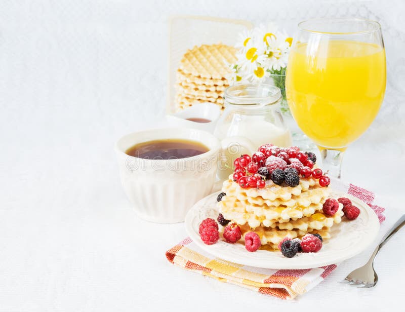 Breakfast with Tea, Waffles, Berries and Juice Stock Image - Image of ...