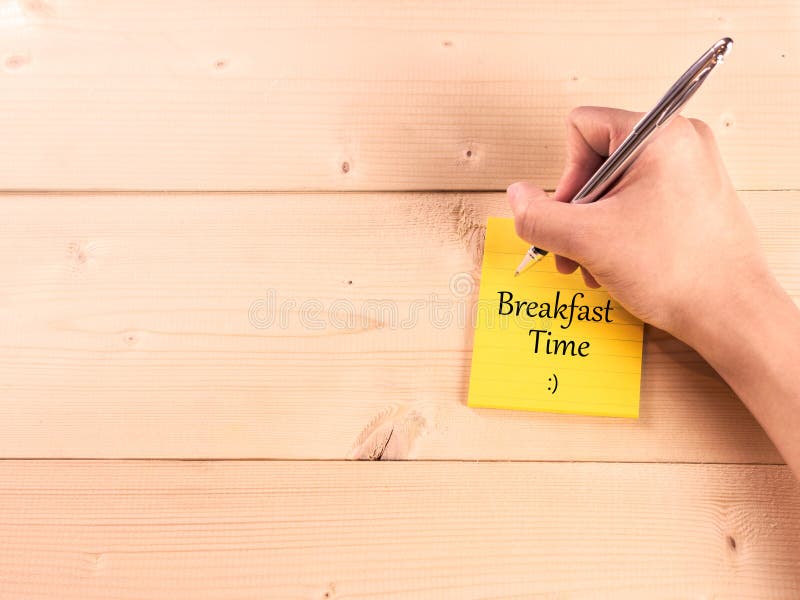 Breakfast Time on Sticky Note with Hand Writing on Wood Table Stock ...