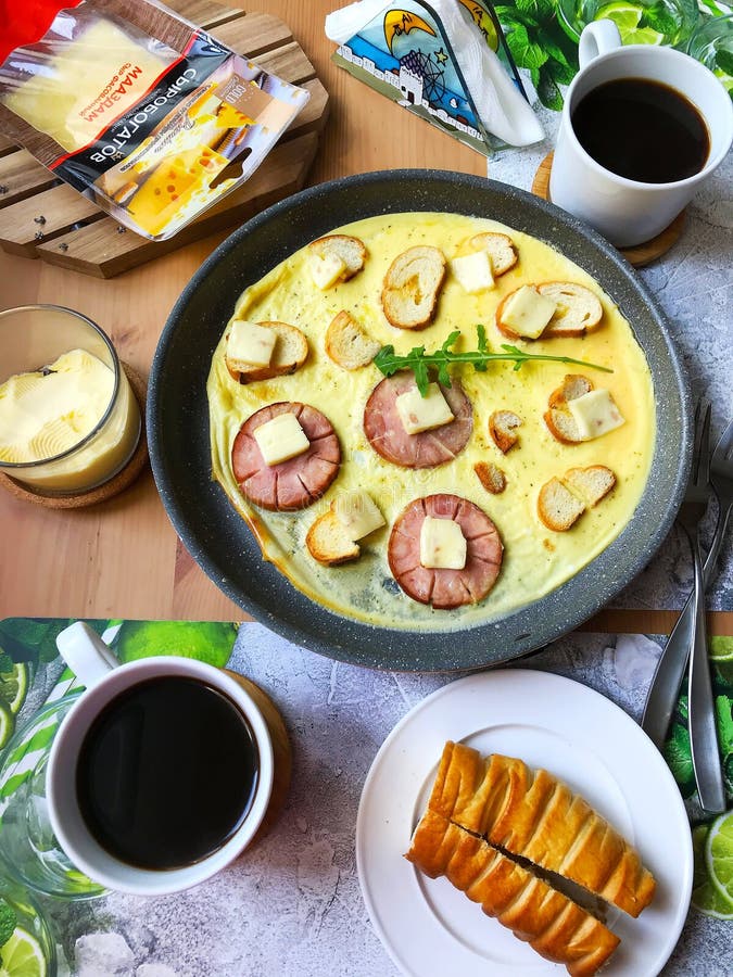 Breakfast with Two Cups of Coffee, Omelette, Cheese, Herbs and ...