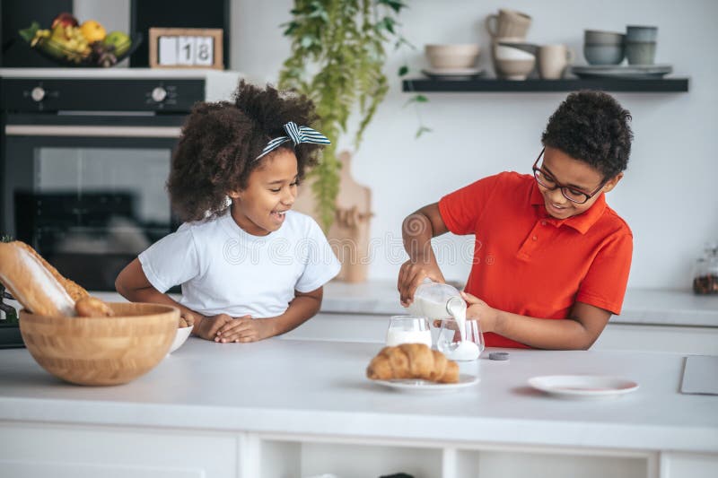 Two Kids in the Kitchen Having Breakfast Stock Image - Image of lactose ...