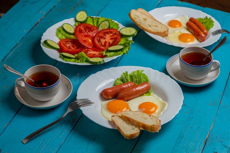 Breakfast for Two Persons Fried Eggs with Sausages Crispy White Bread ...