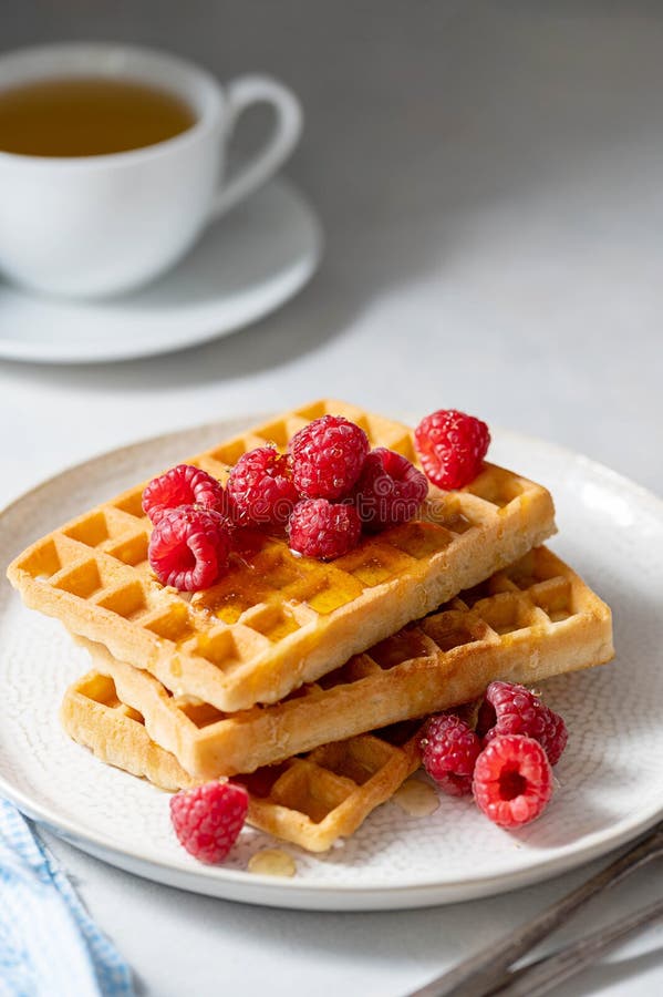 Breakfast Waffles with Berries in Plate Served with Cup of Tea. Stock ...