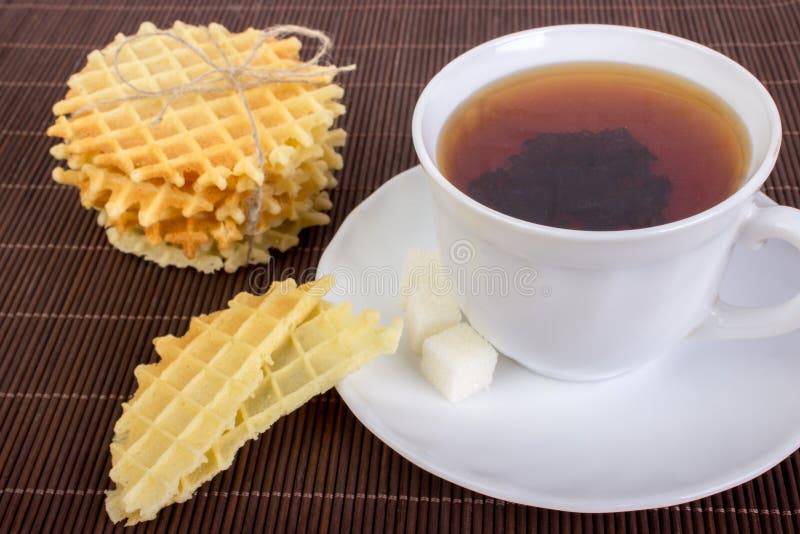 Breakfast with Waffles, Black Cup of Tea and Pieces of Waffle on Wooden ...