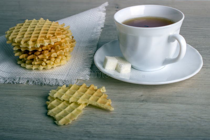 Breakfast with White Cup of Black Tea with Waffles Stack on Napkin and ...