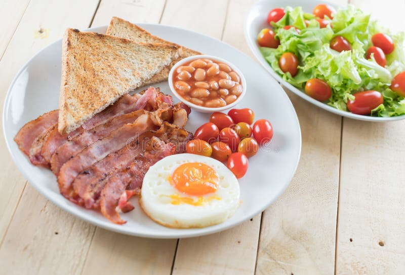 Breakfast on wood table stock photo. Image of plate, beans - 85614988