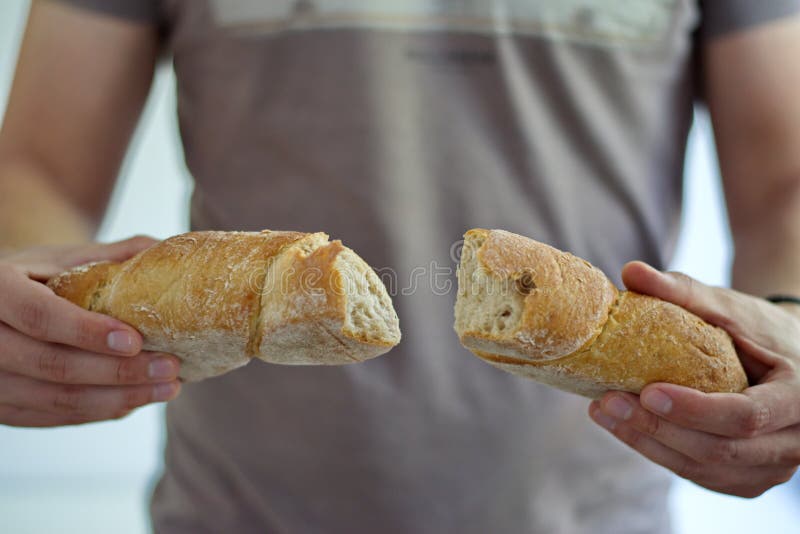 Breaking Baked Bread Loaf in Half Stock Photo - Image of flour, finger ...
