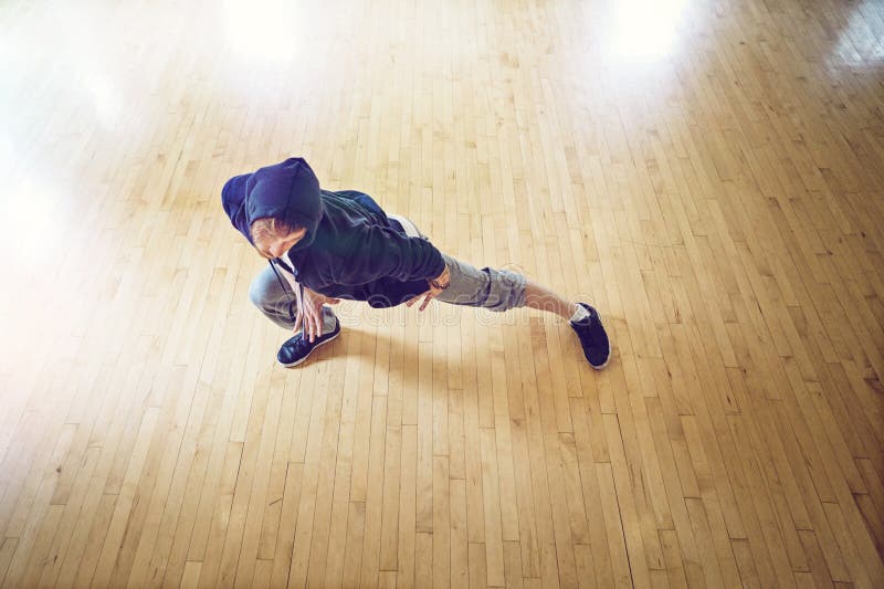 Breaking it Down. High Angle Shot of a Young Man Breakdancing in a ...