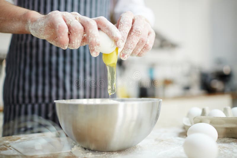 Breaking egg stock image. Image of dough, human, professional - 95511335