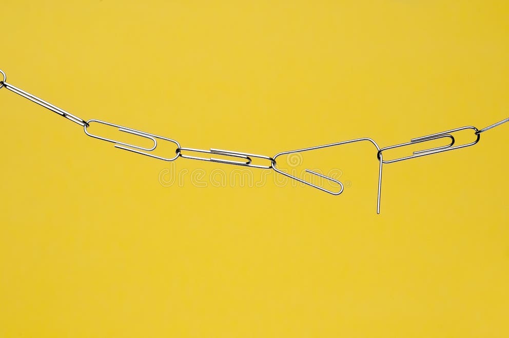 Breaking Paperclip Chain on Yellow Stock Photo - Image of link, steel ...