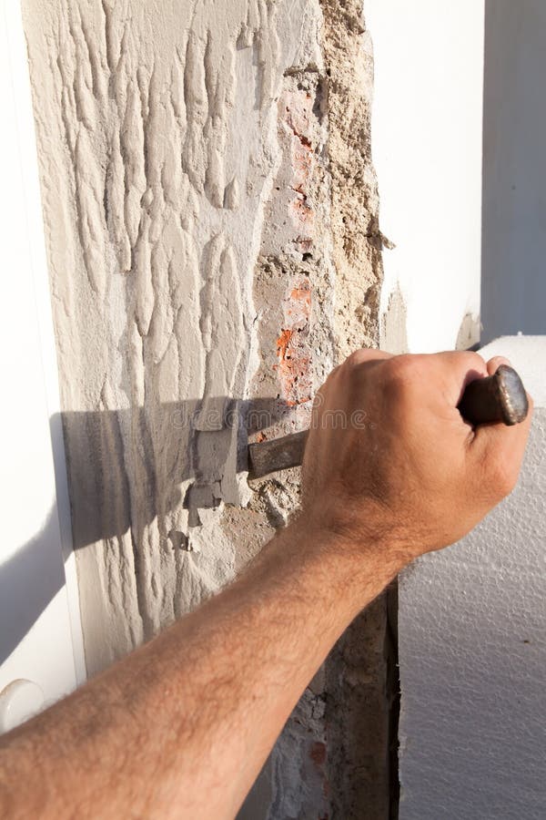 Breaking Plaster during the Reconstruction of the House. Stock Photo ...