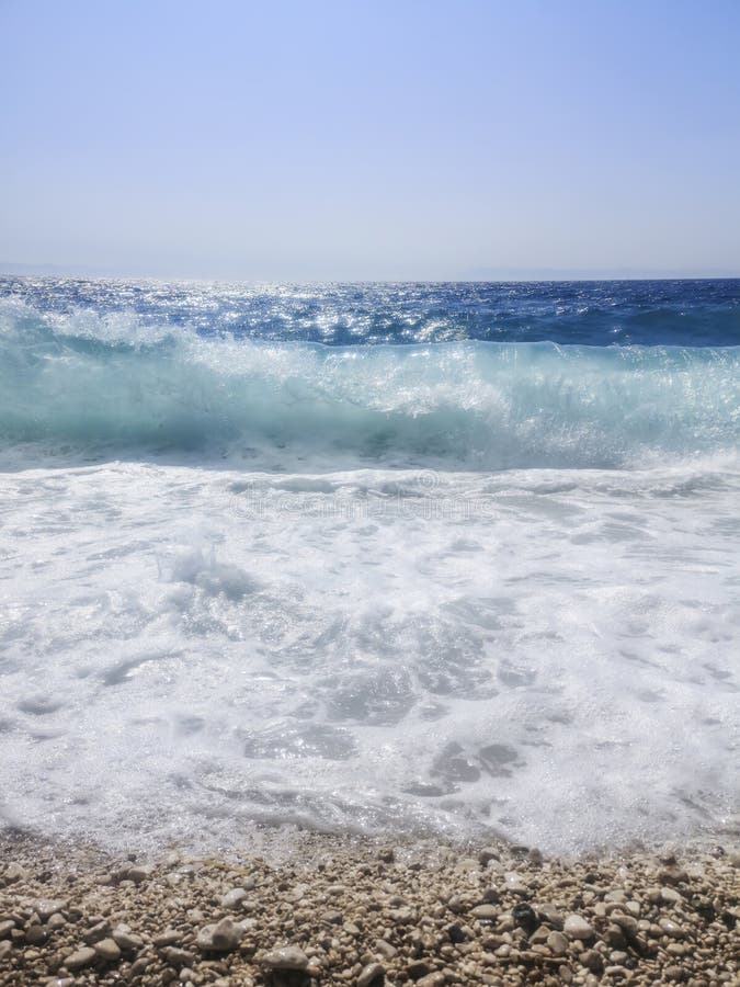 Breaking Wave of Blue Ocean on Pebbles Beach Summer Stock Photo - Image ...
