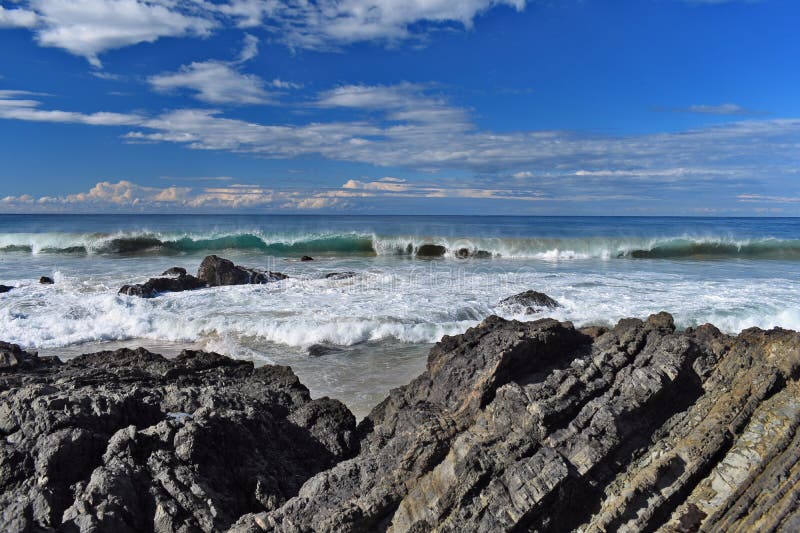Breaking Wave with Submerged Rocks on Shoreline Stock Image - Image of ...