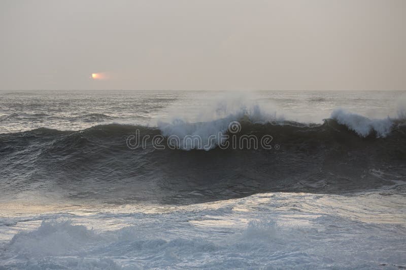 Breaking wave at sunset stock image. Image of breaking - 316767263
