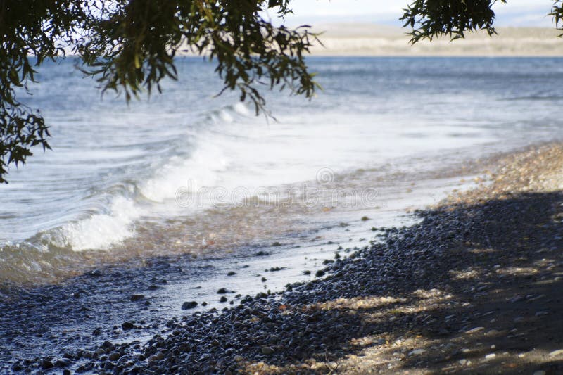 Breaking waves at a lake stock photo. Image of landscape - 143290062