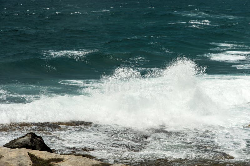 Breaking waves over rocks stock image. Image of breaking - 29663221