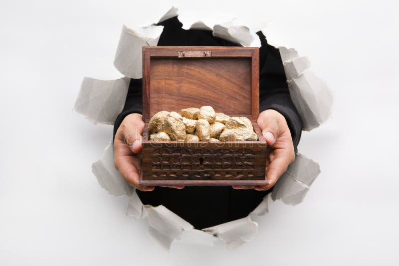 Breakthrough Wall Holding Treasure Chest Stock Image - Image of fingers ...