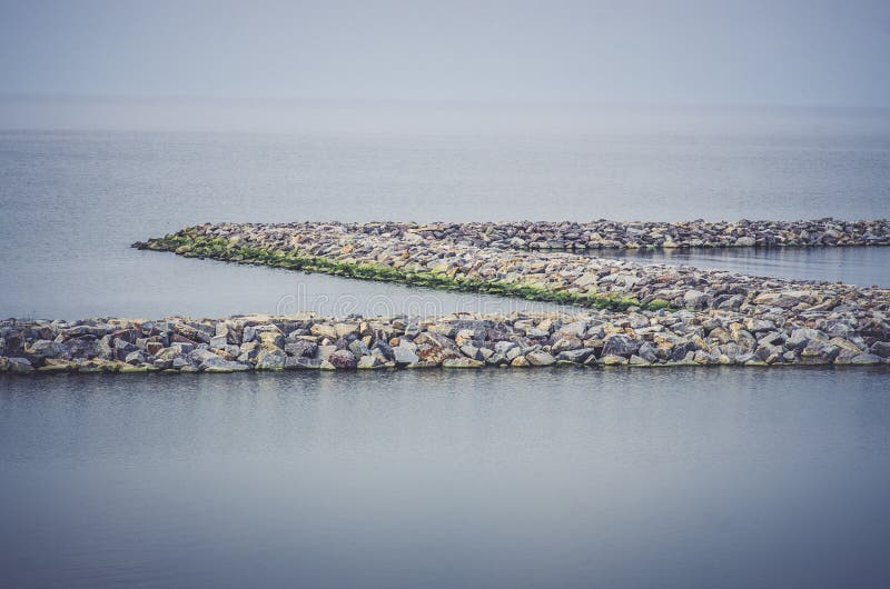 The Breakwater in the Form of a Strip of Stones Stretches Out into the ...