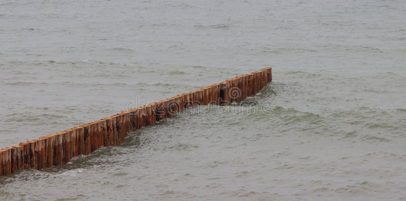 Breakwater from Logs into the Sea Stock Photo - Image of logs ...