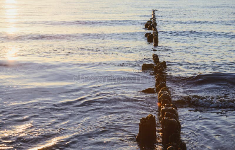 Breakwaters in the Baltic Sea Over the Sunset Stock Image - Image of ...