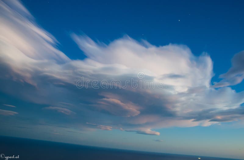 Breathtaking Low Angle Shot of Fluffy Clouds in the Sky and the Ocean ...