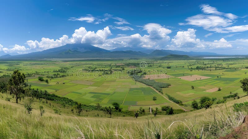 A Breathtaking Panoramic View of a Large, Green Volcano with a Fluffy ...