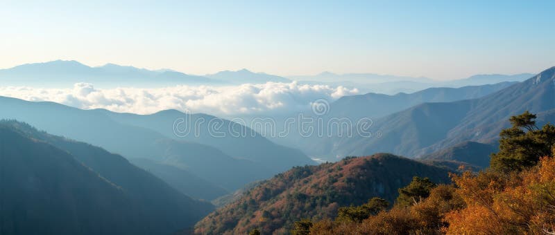 Breathtaking Panoramic View of a Mountain Range with Low-Lying Clouds ...