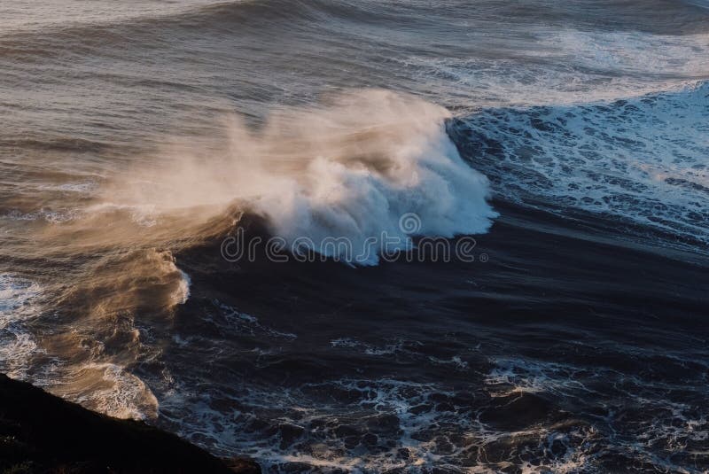 Breathtaking Scene of a Big Wave Breaking at Sunset Stock Image - Image ...